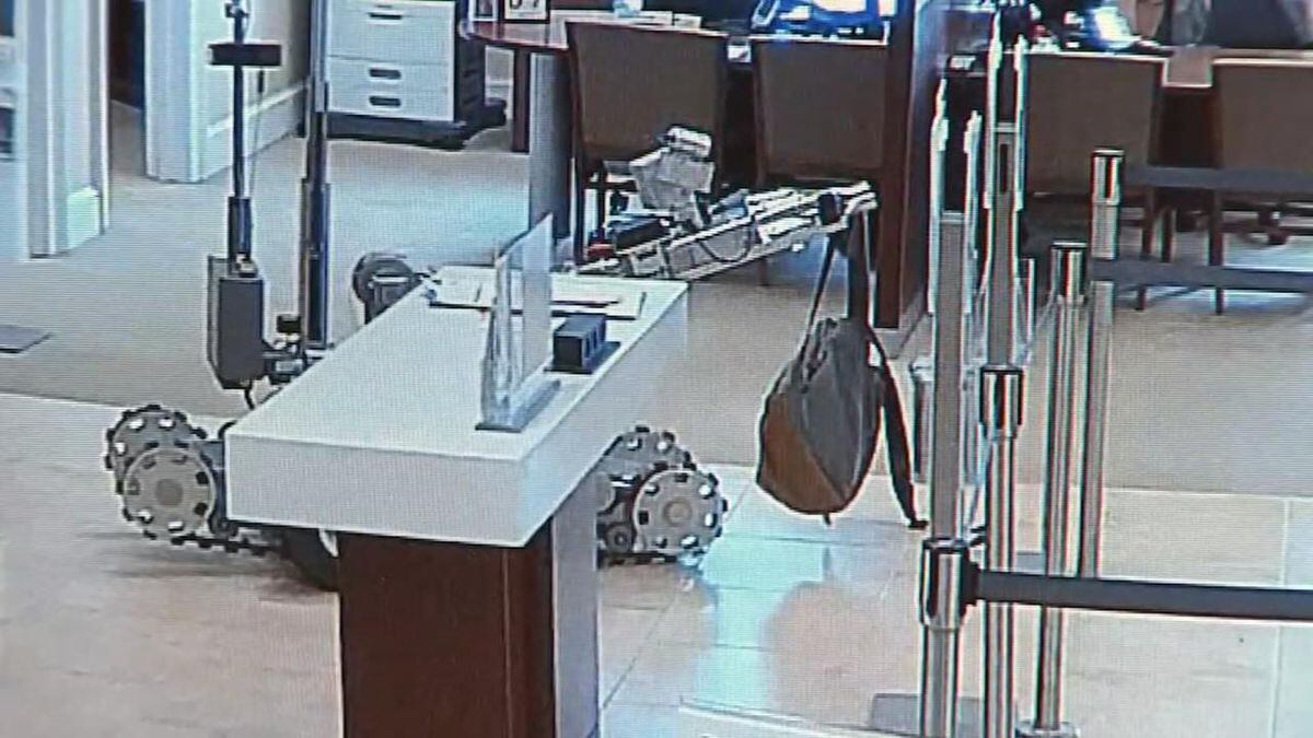 Grand jury clears officer who shot Marine veteran in bank standoff