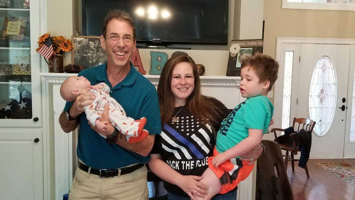 Clark Howard visits fallen officer's family, delivers nearly $40K in ...